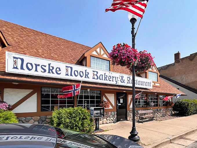 The storybook exterior of Norske Nook beckons like a Norwegian fairytale, complete with stone foundation and flags that say "come hungry, leave happy."
