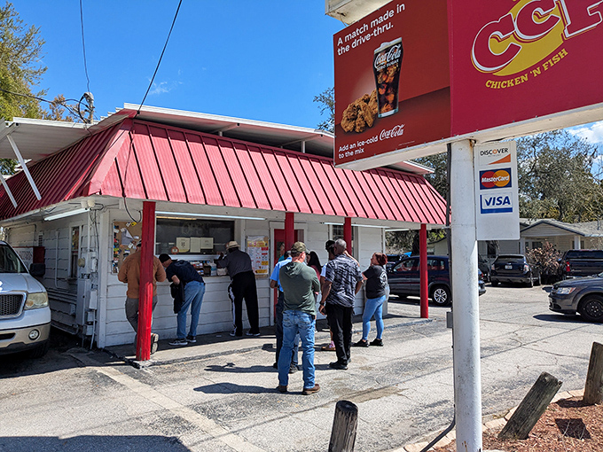 The iconic red-roofed shack draws a steady line of locals who know that culinary treasures often hide in the most unassuming packages.