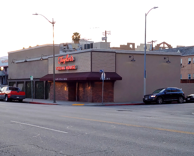 The unassuming brick facade of Taylor's Steak House stands like a culinary speakeasy, promising carnivorous delights behind its modest exterior.