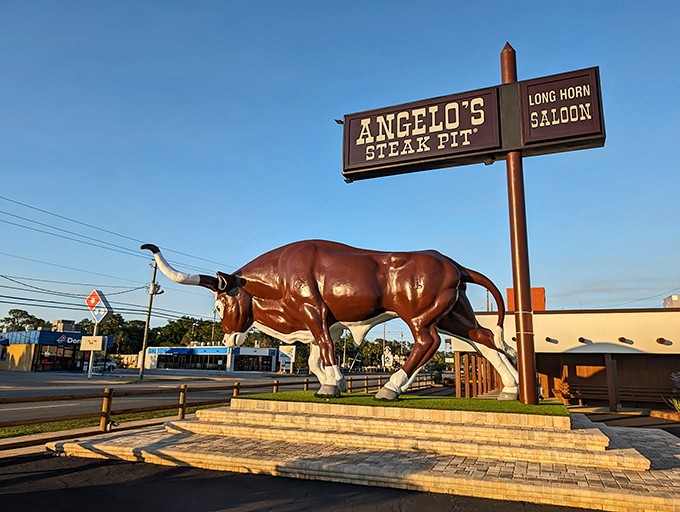 The legendary bull statue stands guard outside Angelo's Steak Pit, a beacon for carnivores that's more reliable than any GPS. "Turn at the giant bull" is local shorthand for "prepare for deliciousness."