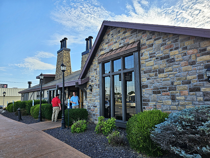 Rustic stone walls and lush landscaping welcome hungry visitors like an edible fairytale castle where the happy ending involves perfectly cooked beef.