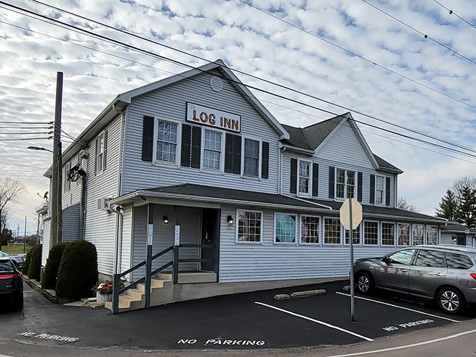 The weathered wooden sign and charming staircase welcome you to Indiana's oldest restaurant&mdash;no neon required when history speaks this loudly.