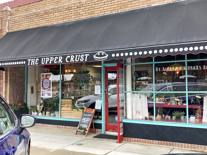 The charming storefront beckons like a siren song for pie lovers. That black awning and teal trim practically whisper, "Yes, happiness lives here."