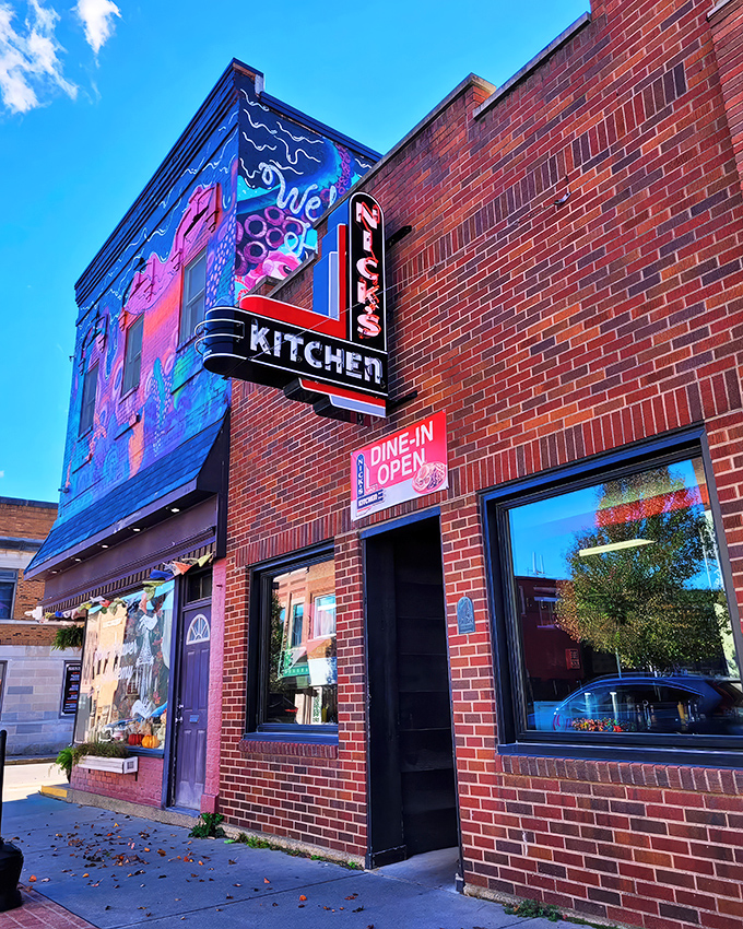 That classic neon sign against brick isn't just advertising – it's a beacon of hope for hungry Hoosiers seeking comfort food salvation.