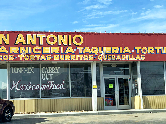 The bright red signage of Don Antonio stands out like a beacon of culinary promise against the Kansas sky, beckoning hungry travelers with its straightforward mission.