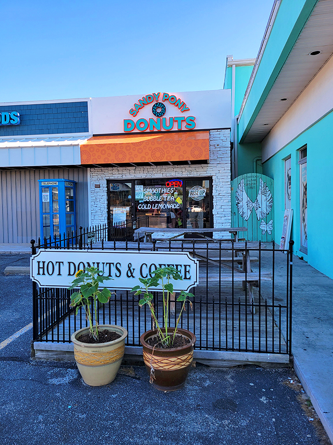 The turquoise beacon of breakfast bliss stands proudly on Bethany Beach's coastline, promising hot donuts that are worth every sandy footprint you'll track inside.