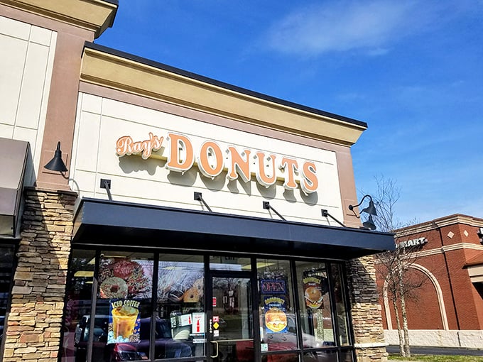 Ray's Donuts announces itself with understated confidence, its stone facade and orange lettering promising sweet treasures within like a suburban Willy Wonka factory.