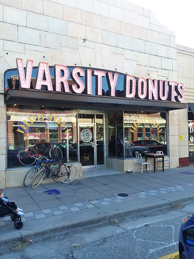 That pink neon sign isn't just announcing donuts&mdash;it's broadcasting joy to Aggieville. Like a beacon of sweetness on Manhattan's Moro Street.