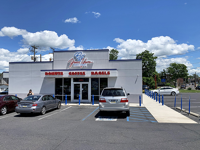 The modest white exterior of Yum Yum Bake Shop belies the sweet treasures within. No architectural frills, just a singular focus on donut perfection.