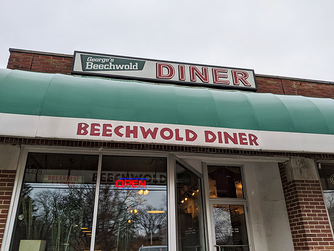 The blue awning of George's Beechwold Diner stands like a beacon of breakfast hope on Columbus's north side, promising comfort food salvation to all who enter.