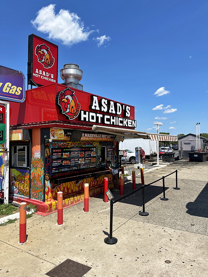 Asad's vibrant exterior stands out like a spicy beacon of hope, complete with Philadelphia sports murals and those distinctive orange bollards guarding the perimeter.