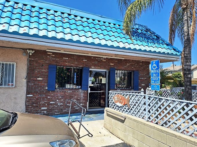 The turquoise roof of Shrimp House stands out like a maritime beacon in suburban Arcadia, promising seafood treasures within its humble brick walls.