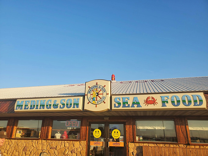 The iconic blue and white sign of Meding's stands like a maritime beacon, promising seafood treasures to those wise enough to stop.