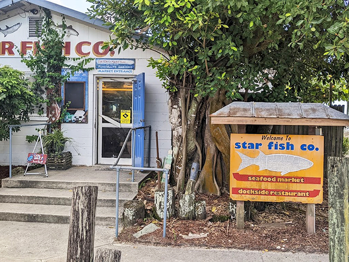 The unassuming entrance to seafood paradise &ndash; where blue doors and weathered wood promise authentic Florida flavors without an ounce of pretension.