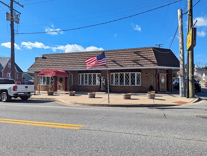The corner brick building with its sloped roof and American flag stands like a sentry guarding Maryland's seafood heritage. Schultz's doesn't need flash&mdash;just decades of seafood expertise.