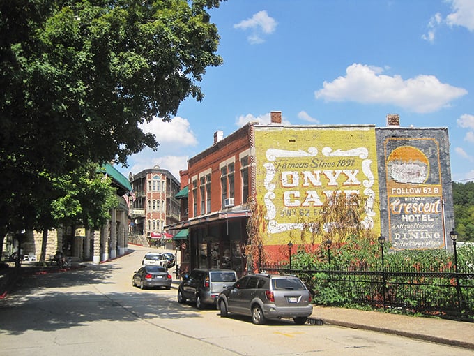 Downtown Eureka Springs winds like a Victorian dream, where red brick buildings and stone facades create a living postcard of Ozark Mountain charm.