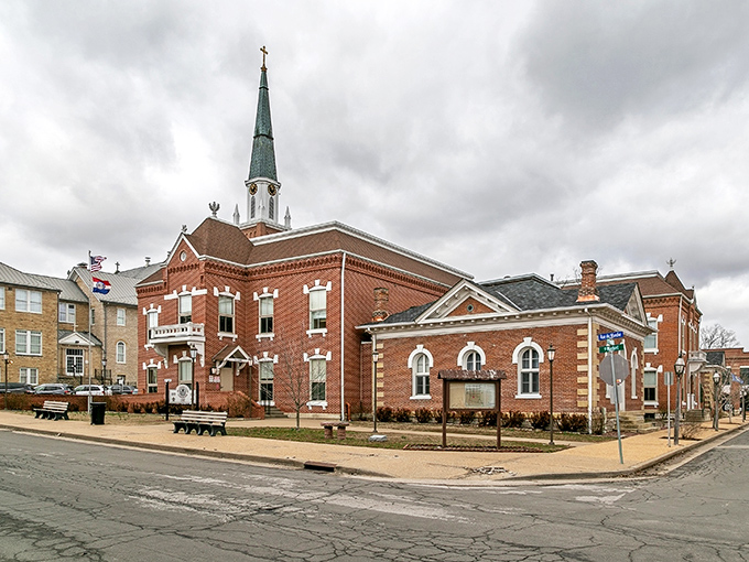 The historic Hotel Ste. Genevieve stands as a red brick sentinel to the past, welcoming visitors with its wraparound porch and promise of stories within.