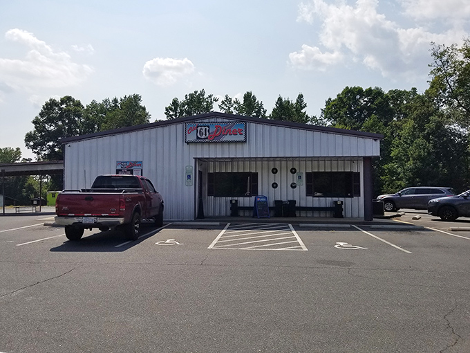 The classic checkered border sign beckons like a time portal to the 1950s. No DeLorean required for this journey back in time.