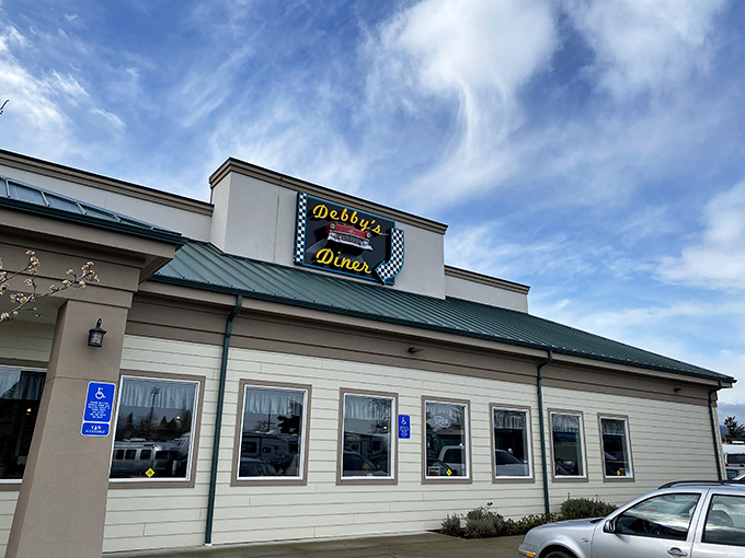 Debby's Diner stands proudly against Oregon's sky, its checkered sign promising a journey back to simpler times when calories weren't counted, just enjoyed.
