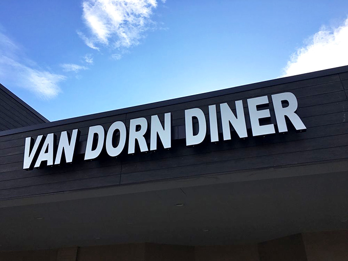 The retro signage beckons like a time machine with a lunch special. Van Dorn Diner's exterior promises a journey back to when calories didn't count and jukeboxes ruled.