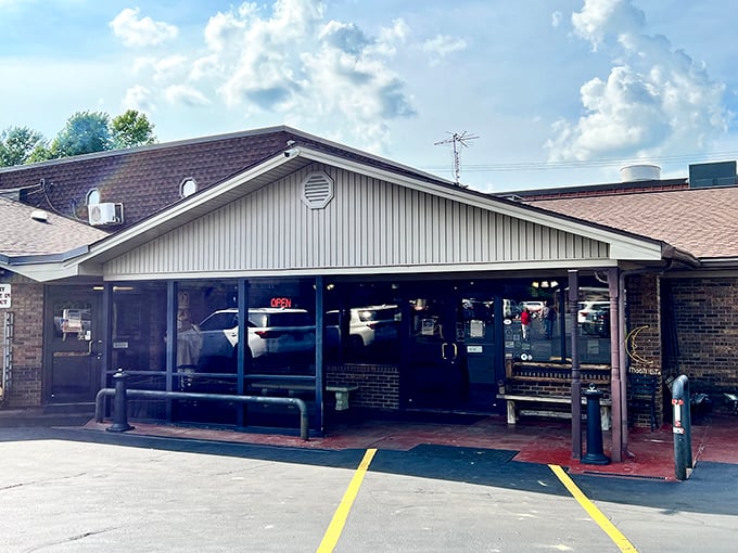 The unassuming exterior of Moonlite Bar-B-Q Inn hides a Kentucky treasure that's been perfecting smoky delights since 1963. Barbecue paradise awaits!