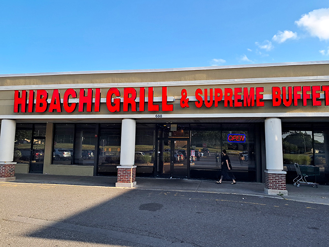 The bright red signage acts like a beacon for hungry souls. Simple storefront, extraordinary promises of culinary abundance within.