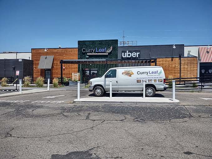 The neon sign beckons like a lighthouse for hungry souls&mdash;Curry Leaf's exterior glows with promise as dusk settles over Albuquerque.