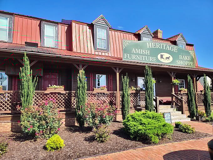 The red metal roof and welcoming wooden porch of Heritage Bake Shoppe stand as a rustic oasis amid Virginia Beach's coastal landscape.