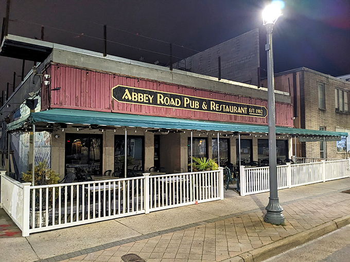 The Beatles would be proud! Abbey Road Pub's colorful exterior mural announces its musical inspiration while promising British comfort food with an oceanside twist.