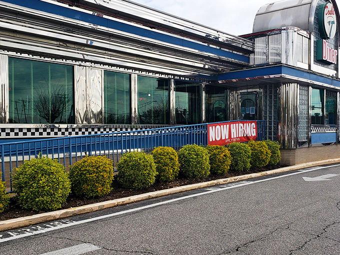 The retro facade of Double T Diner glows like a beacon for hungry travelers. Classic glass blocks and chrome trim scream "authentic American diner experience."