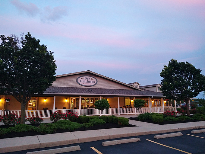 The welcoming facade of Der Dutchman stands like a beacon of comfort food, promising Amish delights that'll make your taste buds do a happy dance.
