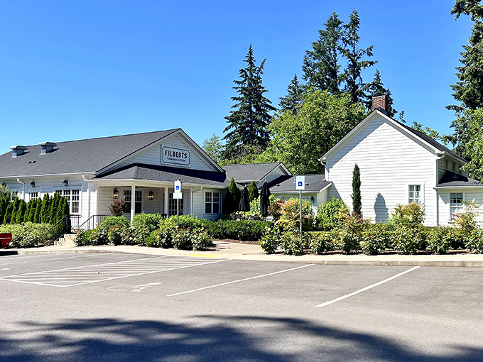 The classic white farmhouse exterior of Filberts beckons like an old friend, promising comfort food that'll make you forget your troubles at the door.