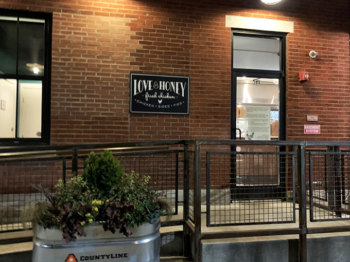 The unassuming brick facade of Love & Honey Fried Chicken in Northern Liberties hides culinary treasures that would make Colonel Sanders weep with envy.