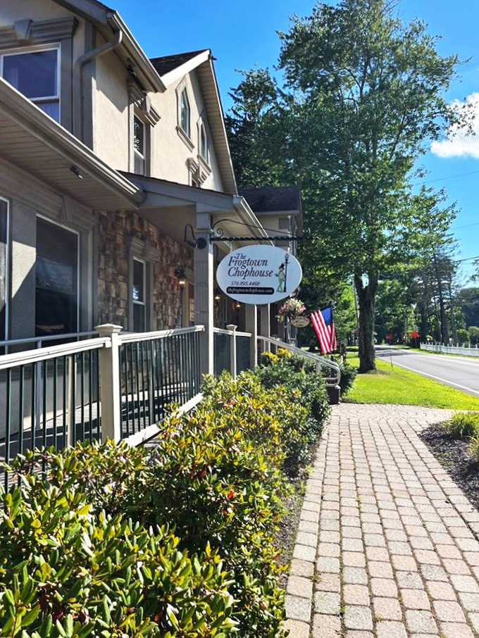 The Frogtown Chophouse stands proudly against the Pocono sky, its inviting porch practically whispering, "Come in, hungry traveler, prime rib awaits."
