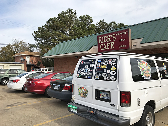 The unassuming brick exterior of Rick's Cafe stands like a culinary lighthouse, its green roof and straightforward signage promising honest food without pretense.