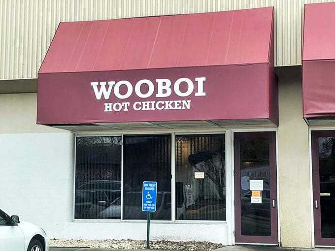The burgundy awning beckons like a siren song to heat-seekers. WOOBOI's unassuming strip mall location hides culinary fire within.