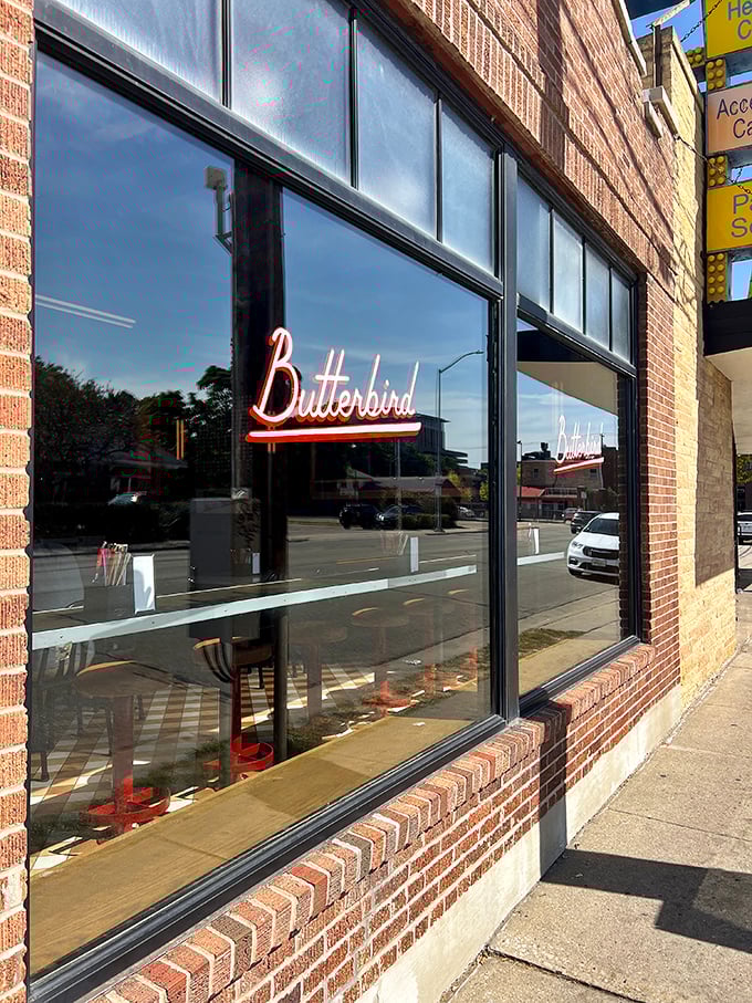 The glowing "BUTTERBIRD" sign against brick is Madison's bat signal for fried chicken enthusiasts. Simple, unassuming, and hiding delicious secrets within.