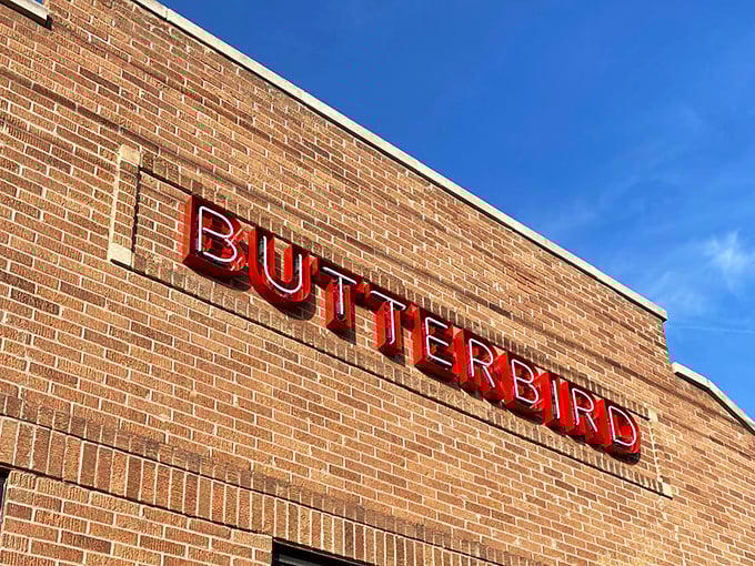 The glowing "BUTTERBIRD" sign against brick is Madison's bat signal for fried chicken enthusiasts. Simple, unassuming, and hiding delicious secrets within.