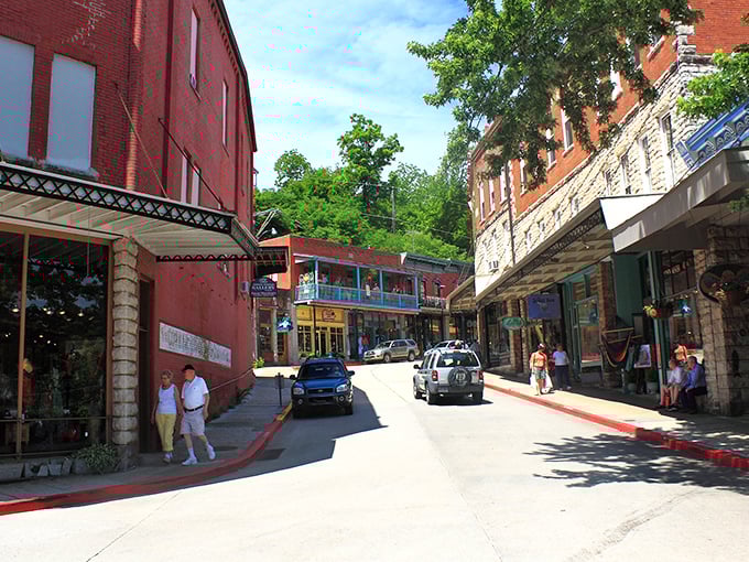 Downtown Eureka Springs winds like a Victorian dream, where red brick buildings and stone facades create a living postcard of Ozark Mountain charm.