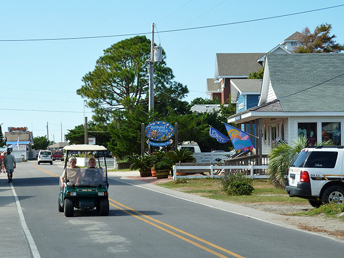 Ocracoke's main street at dusk feels like stepping into a storybook &ndash; where every shop has a tale and string lights guide your way home.