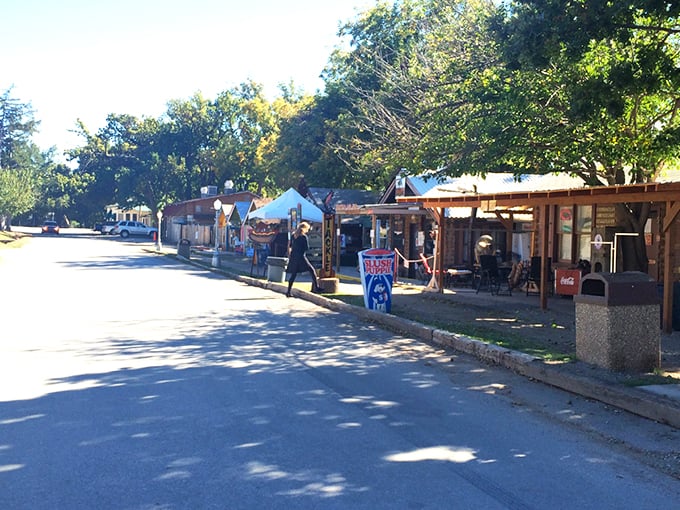 Main Street charm on full display! Medicine Park's cobblestone buildings and American flags create that perfect small-town vibe that makes you want to linger all afternoon.
