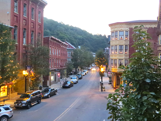 Victorian charm meets mountain majesty in downtown Jim Thorpe, where the Mauch Chunk Opera House stands as a cultural cornerstone against a backdrop of forested hills.