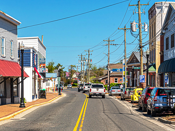 Chincoteague's Main Street feels like stepping into a Norman Rockwell painting where seafood replaces apple pie as the local currency.