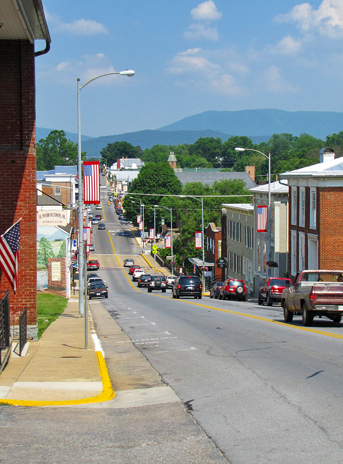 Main Street stretches before you like a Norman Rockwell painting come to life, brick buildings standing proud against the Blue Ridge backdrop.