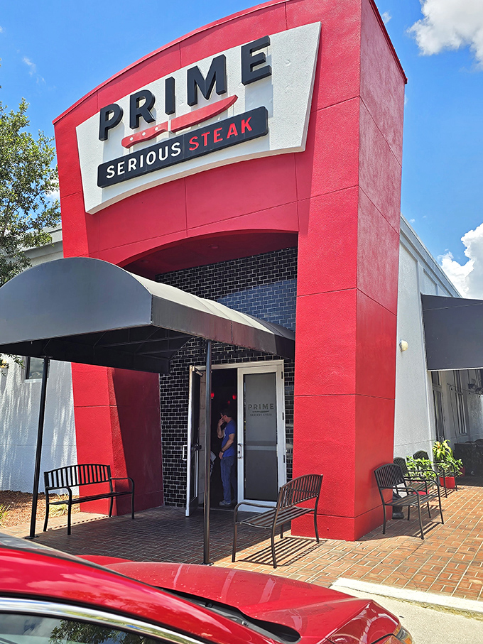 The bold red exterior doesn't whisper, it announces: "Serious steak happens here." This architectural meat manifesto in Port Charlotte means business.