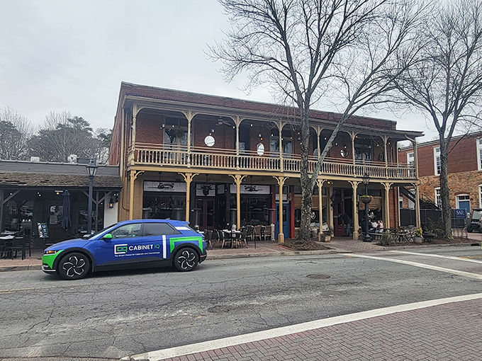 Historic charm meets culinary excellence at Little Alley's Roswell location. The two-story building's classic Southern architecture beckons like an old friend with a delicious secret.