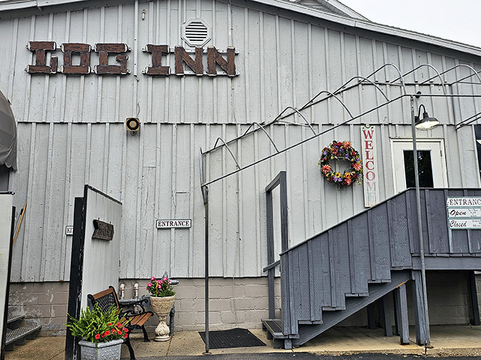 The weathered wooden sign and charming staircase welcome you to Indiana's oldest restaurant—no neon required when history speaks this loudly.
