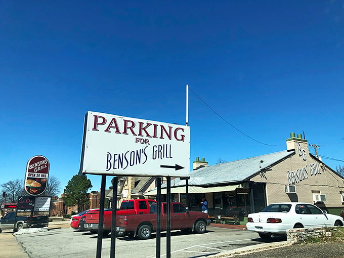 The unassuming exterior of Benson's Grill stands as a beacon to breakfast lovers. That parking sign might as well say "This way to happiness."