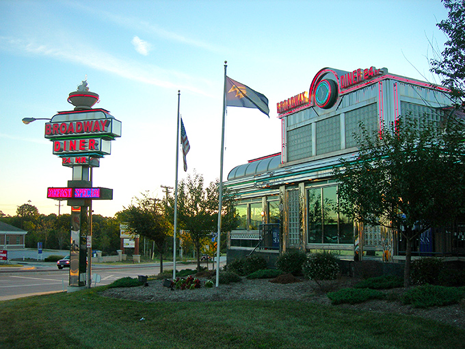 The neon glow of Broadway Diner's sign is like a lighthouse for hungry travelers, promising comfort and satisfaction just off Eastern Avenue.