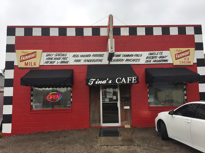 The red and white checkered facade of Tina's Cafe stands like a culinary lighthouse, beckoning hungry travelers with promises of homemade comfort.